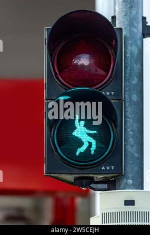 Traffic light man, green illuminated pictogram of rock 'n' roll singer ...