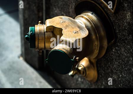 A shiny standpipe with a Siamese connection in the streets of New York ...