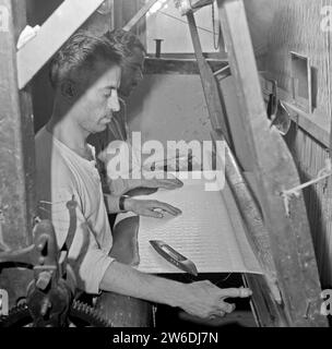 Man weaving brocade ca. 1950-1955 Stock Photo - Alamy