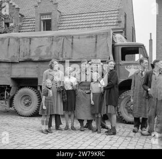 Soldiers of the Irish Guards posing in front of a tank at the Texaco ...