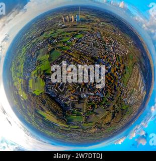 A bird's eye view of a road surrounded by the fish pond and a field at ...