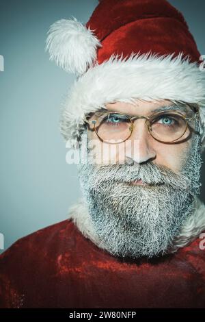 Closeup portrait of serious Santa Claus looking at camera over ...
