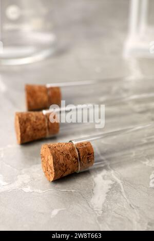 Test tubes on grey marble table, closeup. Laboratory glassware Stock ...