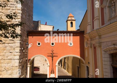 Cross crucifix on arched raised walkway bridge corridor connecting the ...