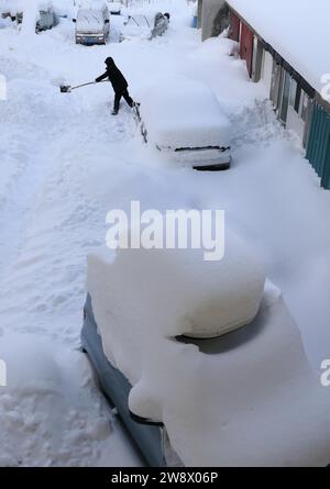 YANTAI, CHINA - DECEMBER 21, 2023 - People walk on the streets brave ...