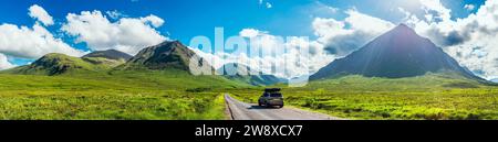 Panorama of Glen Etive and SUV BMW X3 with a roof tent, The Buachaille ...