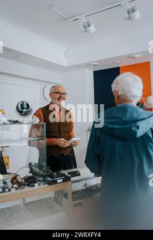 Antique store owner Stock Photo - Alamy