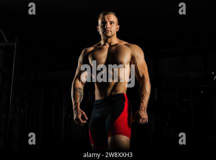 Portrait of a weightlifter who poses without a shirt. Front view Stock ...