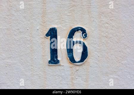Old Weathered House Number 16, Tile on Wall Stock Photo - Alamy