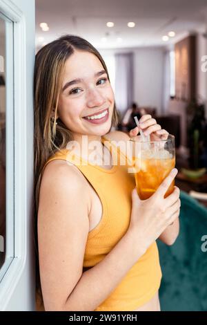 Woman holding iced tea Stock Photo - Alamy