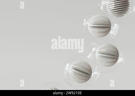 3D render of row of plastic wrapped spheres floating against white ...