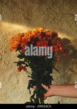 October 5. Bouquet of orange flower in craft envelope and calendar date ...