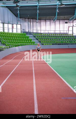 Female Athletes Training on Track Wheelchair Athlete and Hijab-Wearing ...