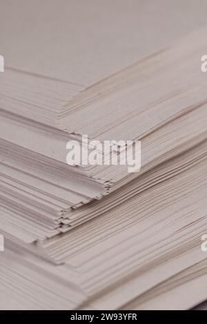 grey low-quality thin paper from recycled waste, paper used for writing ...
