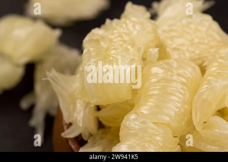 peeled and divided into small pieces ripe pale yellow pomelo, sweet ...