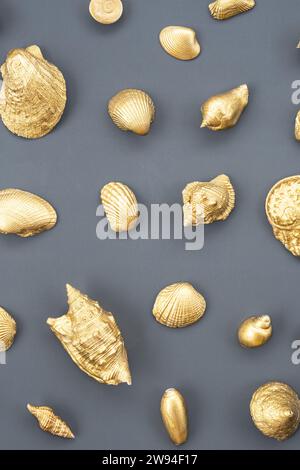Gold sea shells arrangement Stock Photo - Alamy
