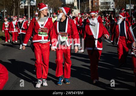 Madrid, Spain. 24th Dec, 2023. Thousands of people dressed as Santa ...