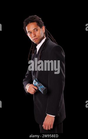 Powerful young man with a gun Stock Photo - Alamy