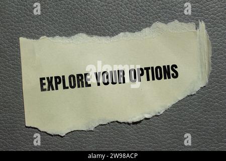 Explore your option lettering on ripped paper. Business concept photo ...