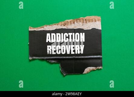 Addiction recovery lettering on ripped paper piece. Conceptual photo ...