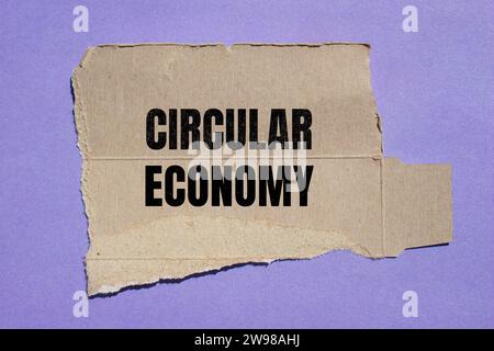 Circular economy lettering on ripped paper. Business concept photo ...