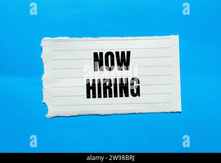 Now hiring lettering on ripped paper. Business recruitment concept ...
