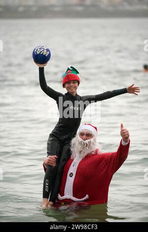 Patrick Corkery dressed as Santa and his son Matthew, 12, dressed as an ...