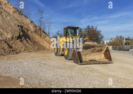 An excavator stopped in a work zone Stock Photo - Alamy