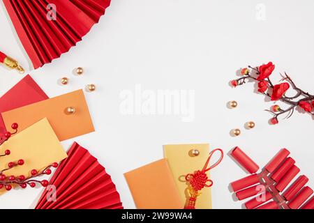 A plate of tangerines, a plate of jam, a string of red firecrackers, a ...