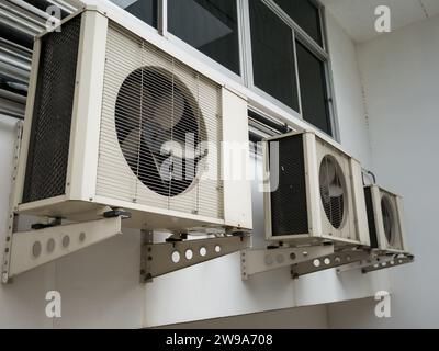 Air conditioner compressor unit installed outdoor in the old building ...