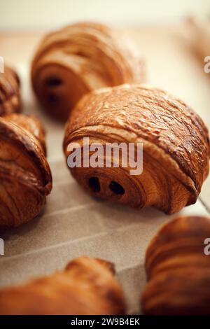 Fresh made Chocolate Croissants (close-up shot) on wooden background ...