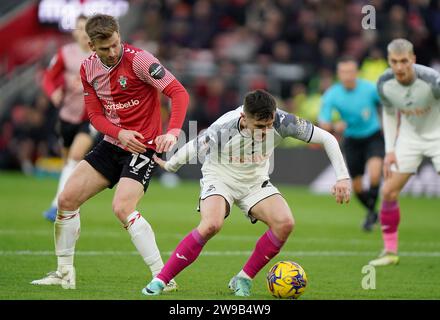 Swansea City's Liam Cullen (centre) battles for the ball with Coventry ...