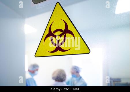 Biohazard warning sign on transparent laboratory door Stock Photo - Alamy