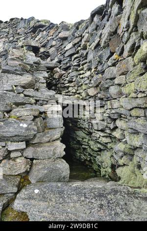 Inside the restored ruins of Dun Carloway Broch, an ancient stone ...