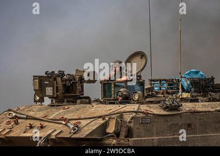 An Israeli armoured personnel carrier (APC) heads towards the Gaza ...