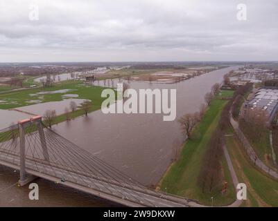 River floodings in the Netherlands with grass lands and trees under ...