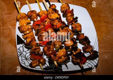 Yummy barbecue have a good meal. Cooking a group of Brochettes on a ...