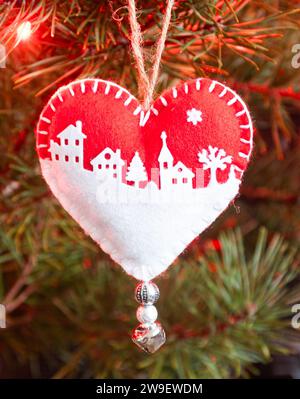 Felt Christmas tree on red background Stock Photo - Alamy