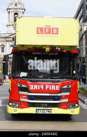 London Fire Brigade Ladder truck on a call out in Soho Square Central ...