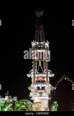 the Orion Offshore Heavy Lift crane moving wind turbine monopiles from ...