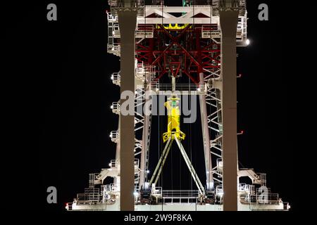 the Orion Offshore Heavy Lift crane moving wind turbine monopiles from ...
