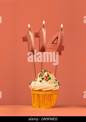 Birthday cake with candle number 114 - Blue background Stock Photo - Alamy