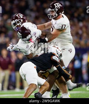 Texas A&M running back Rueben Owens II (4) signals a touchdown against ...
