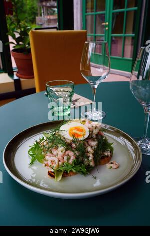 Traditional Scandinavian shrimp toast (toast Skagen) with dill, egg and ...
