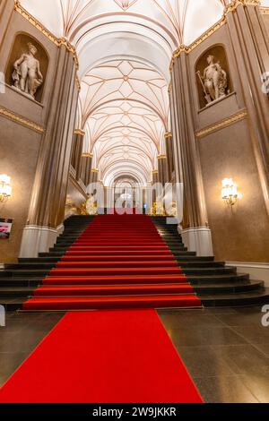 Interior of the Rotes Rathaus with red carpet and elegant staircase ...