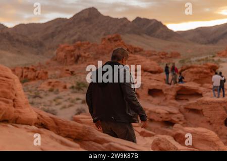 Male Model in the desert during the sunset Stock Photo - Alamy