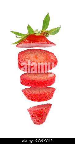 Different ripe strawberries and strawberry slices isolated on pink ...