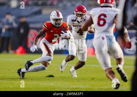 Miami wide receiver Jacolby George (3) runs the ball into the end zone ...