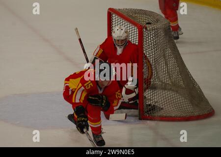 Dumfries, 15 December 2023. Chen Haoran, Tong Zihao and netminder Chen ...