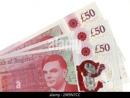 A fan of fifty pound notes featuring a portrait of Queen Elizabeth II ...